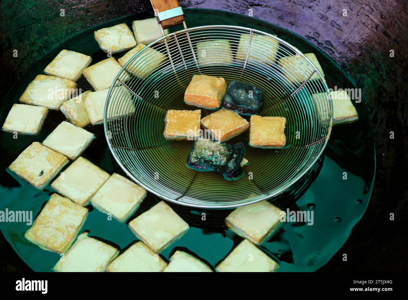 Chinese cooking of fried stinky tofu Stock Photo - Alamy