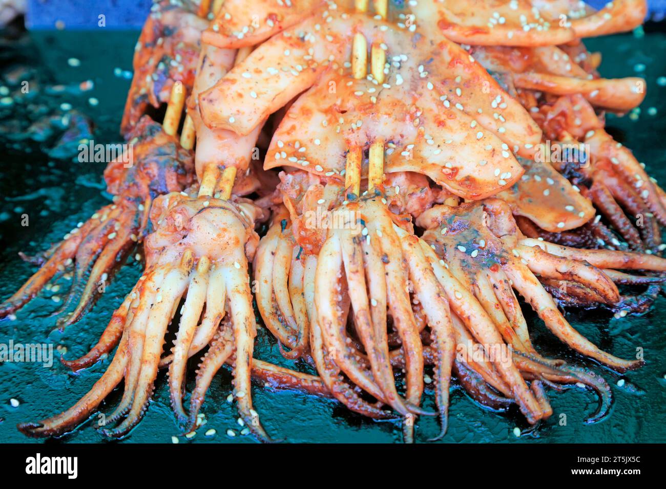 Chinese gourmet fire squid Stock Photo - Alamy