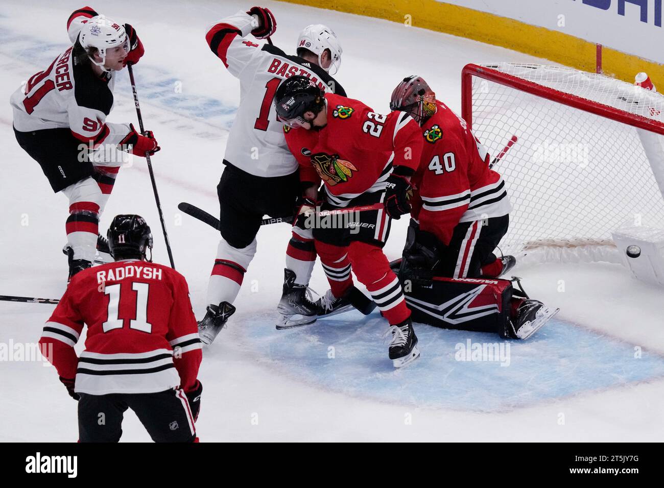 New Jersey Devils center Dawson Mercer, top left, scores against ...