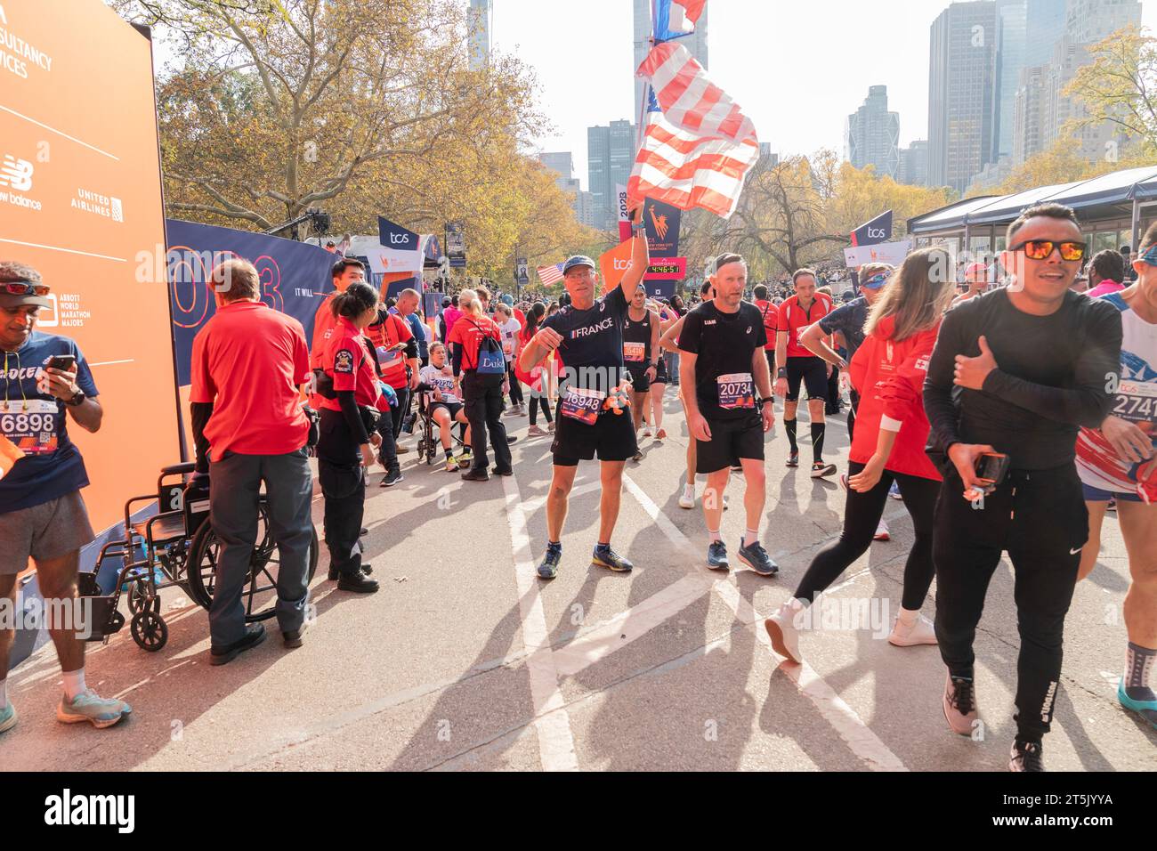 Runners pose after crossing finish line of TCS New York City marathon ...