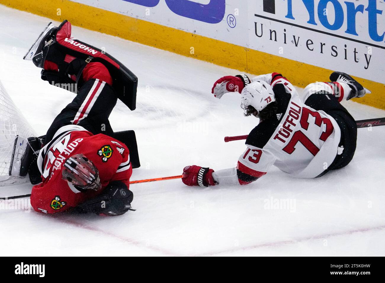 Chicago Blackhawks goaltender Arvid Soderblom, left, and New Jersey ...
