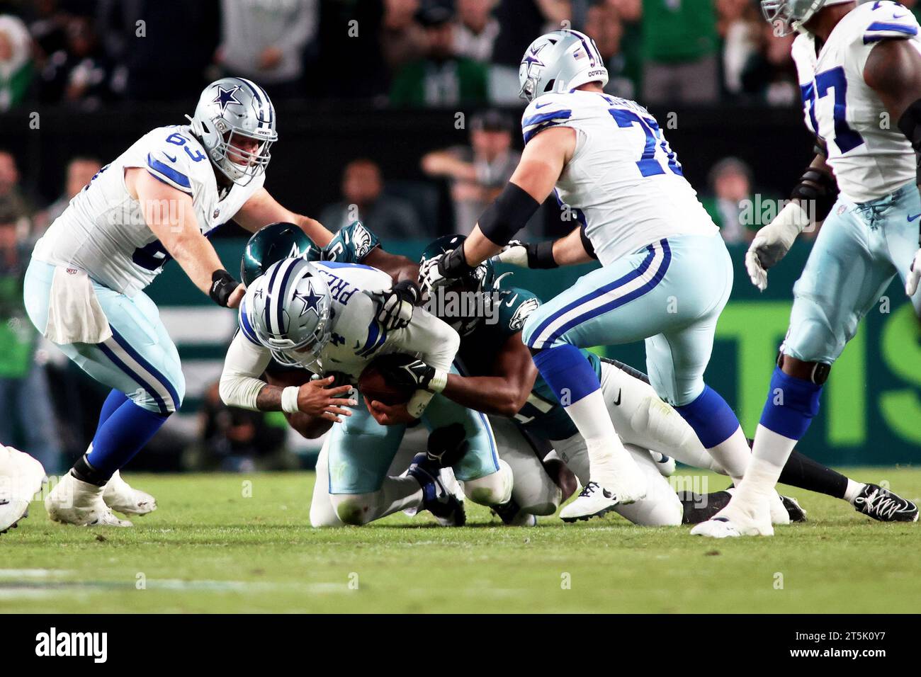 Dallas Cowboys quarterback Dak Prescott (4) gets taken down for a sack ...