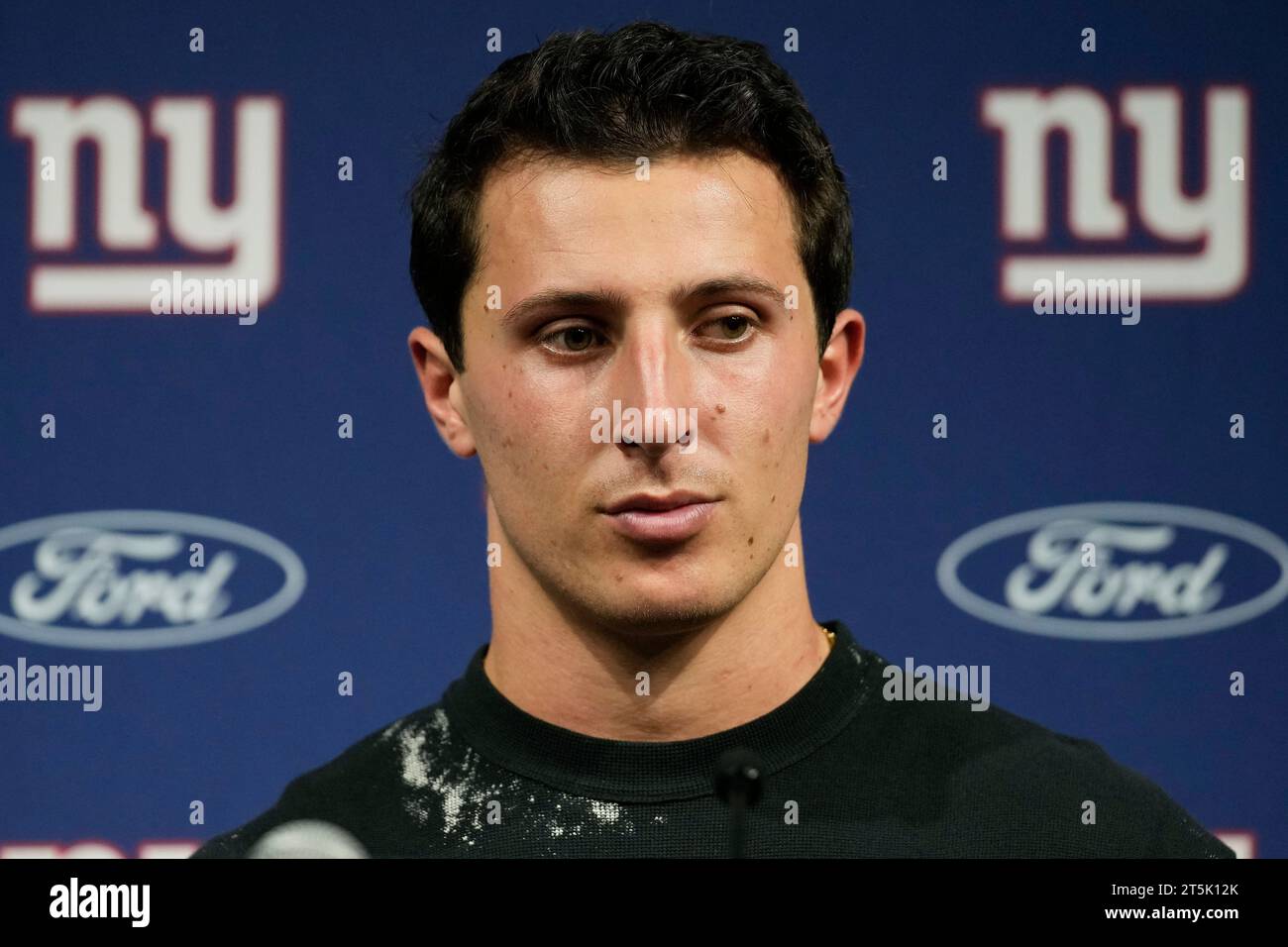 New York Giants quarterback Tommy DeVito (15) speaks during a news ...