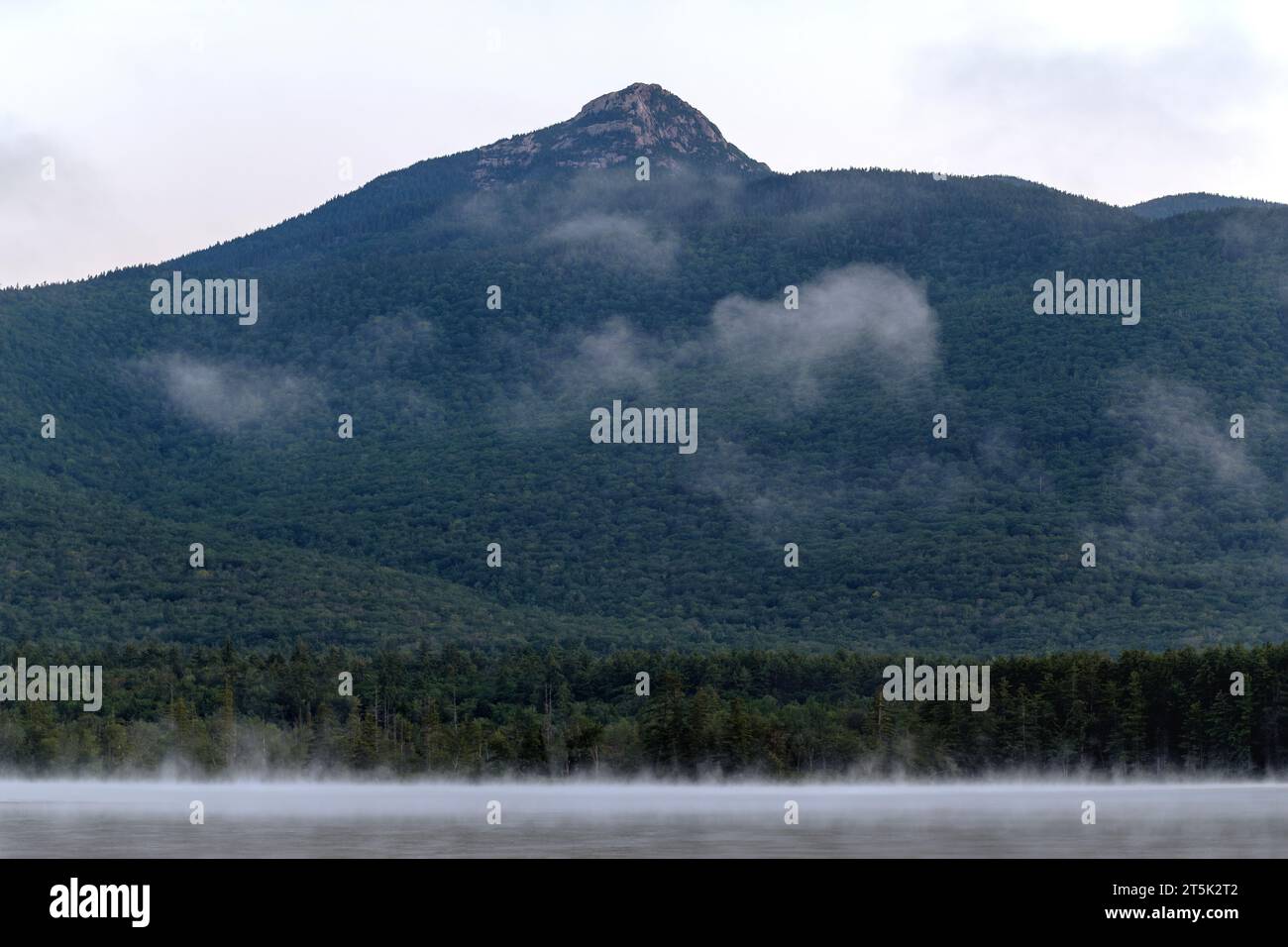 Mount Chocorua rises above Chocorua Lake as dawn breaks on a mid-summer ...