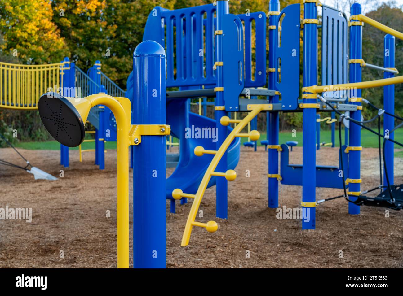 Unidentified typical elementary school playground with engineered wood ...