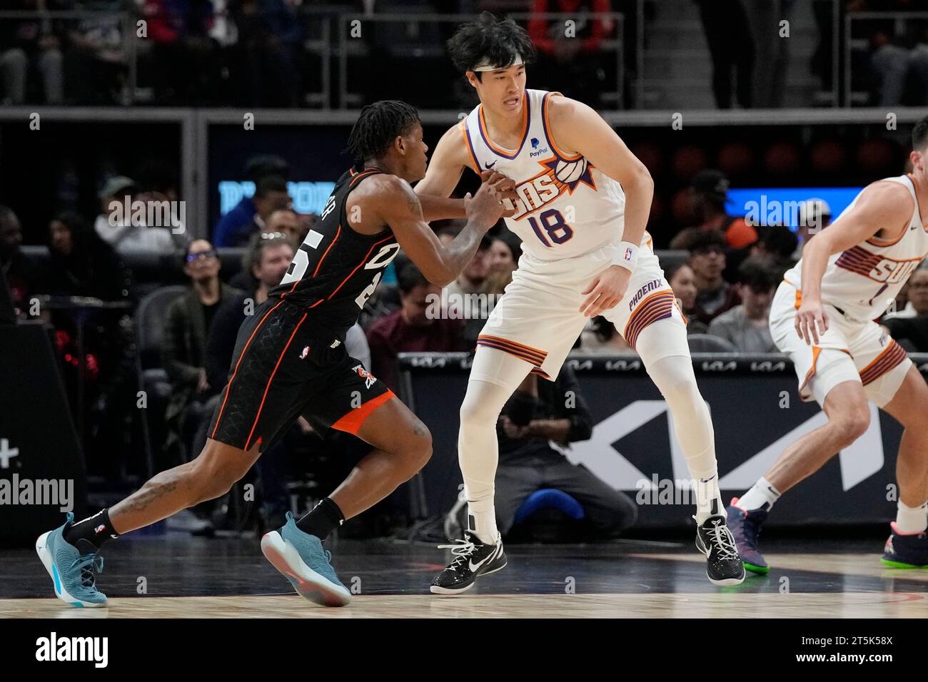 Phoenix Suns forward Yuta Watanabe (18) blocks Detroit Pistons guard ...