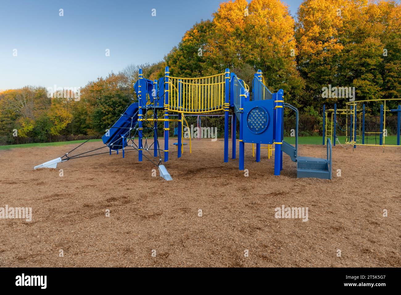Unidentified typical elementary school playground with engineered wood ...