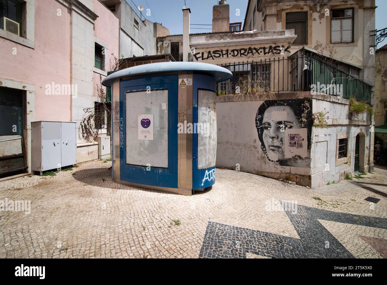 Graffiti covered empty Kiosk and commercial / residential building on ...