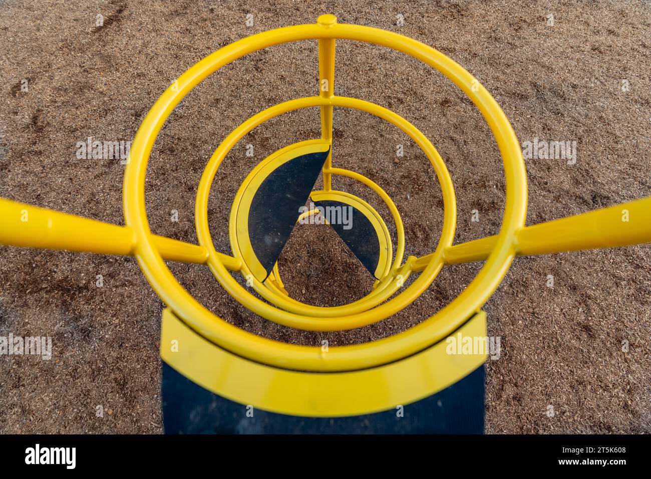 Unidentified typical elementary school playground with engineered wood ...