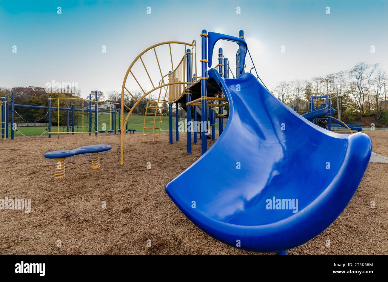 Unidentified typical elementary school playground with engineered wood ...