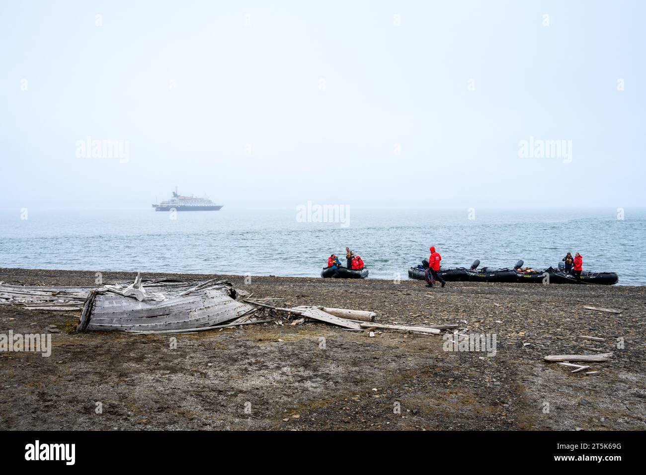 SVALBARD, NORWAY – JULY 28, 2023: arctic tourists off a cruise ship on ...