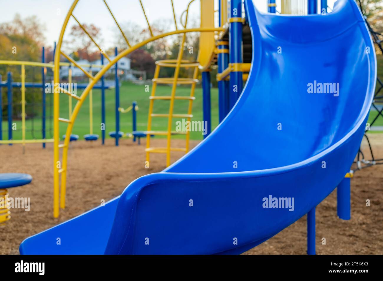 Unidentified typical elementary school playground with engineered wood ...