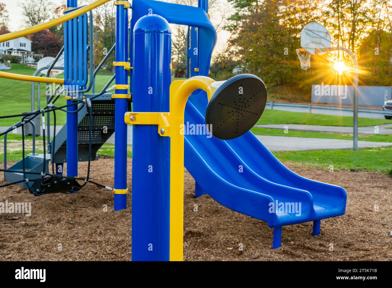 Unidentified typical elementary school playground with engineered wood ...