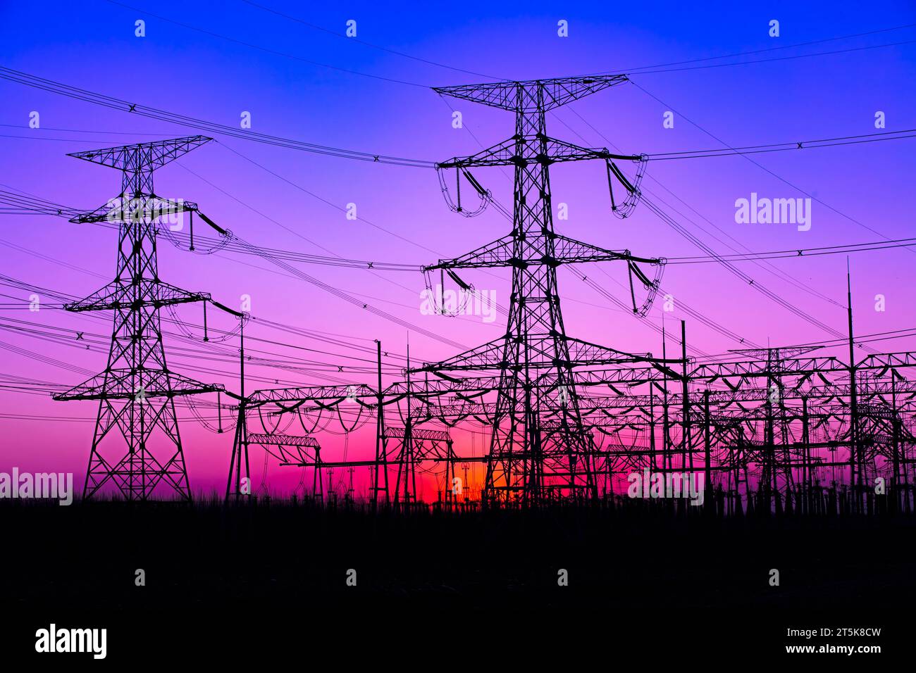 Electric tower in sunset Stock Photo - Alamy