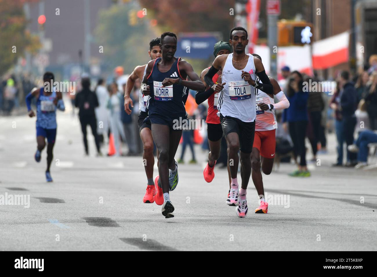 Tamirat Tola, Albert Korir and mens elite runners cross the 13.1 mile ...