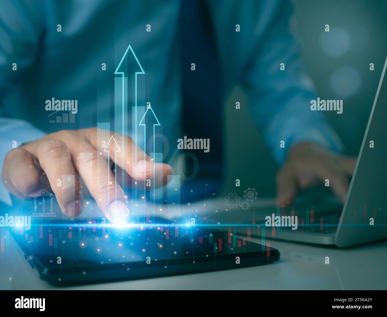 Business development concepts for success and growth. Businessman taps fingers on tablet to ...