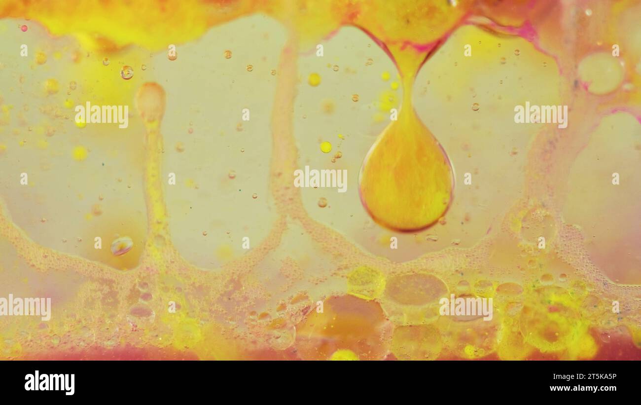 Bubble fluid oil texture paint water drop yellow Stock Photo - Alamy