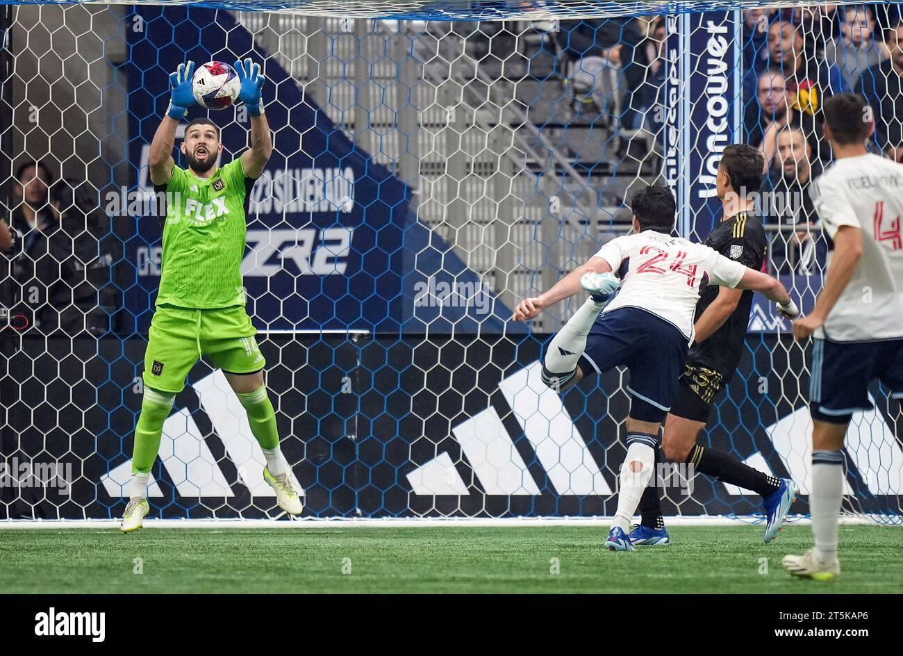 Los Angeles FC goalkeeper Maxime Crepeau, left, stops Vancouver ...