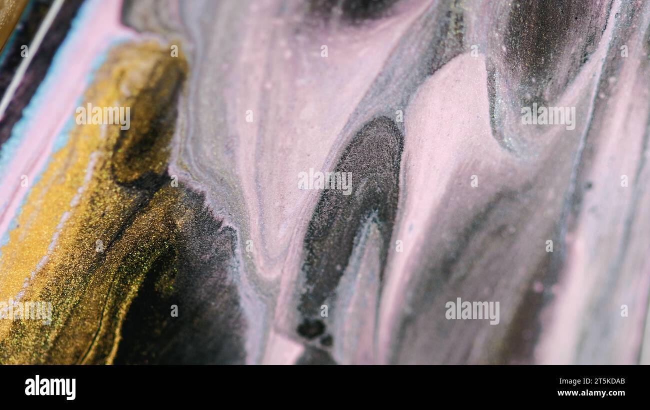 Glitter ink mix fluid art color paint drip flow Stock Photo - Alamy