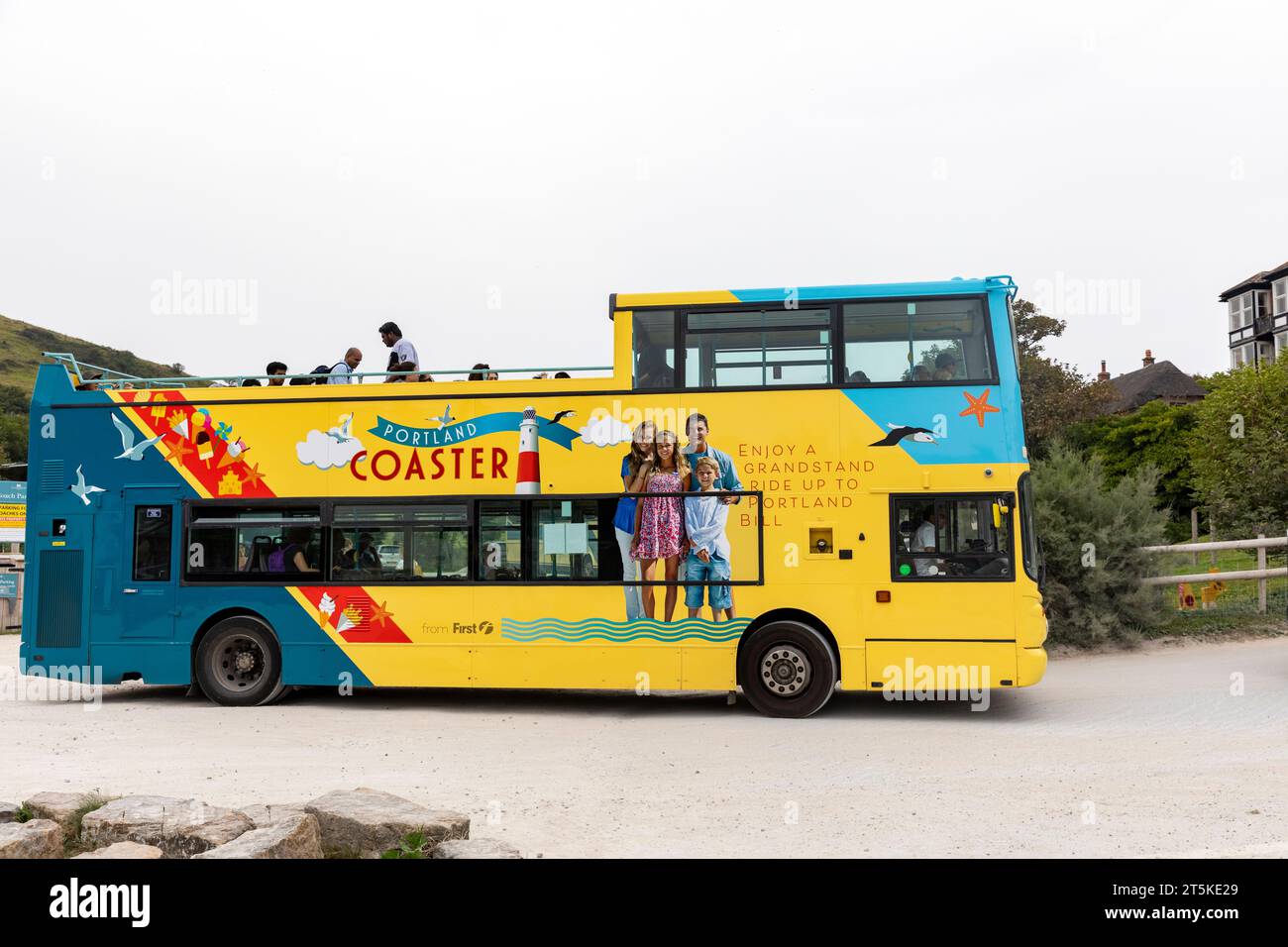 Portland coaster open top tour bus of the Jurassic coast picking up ...
