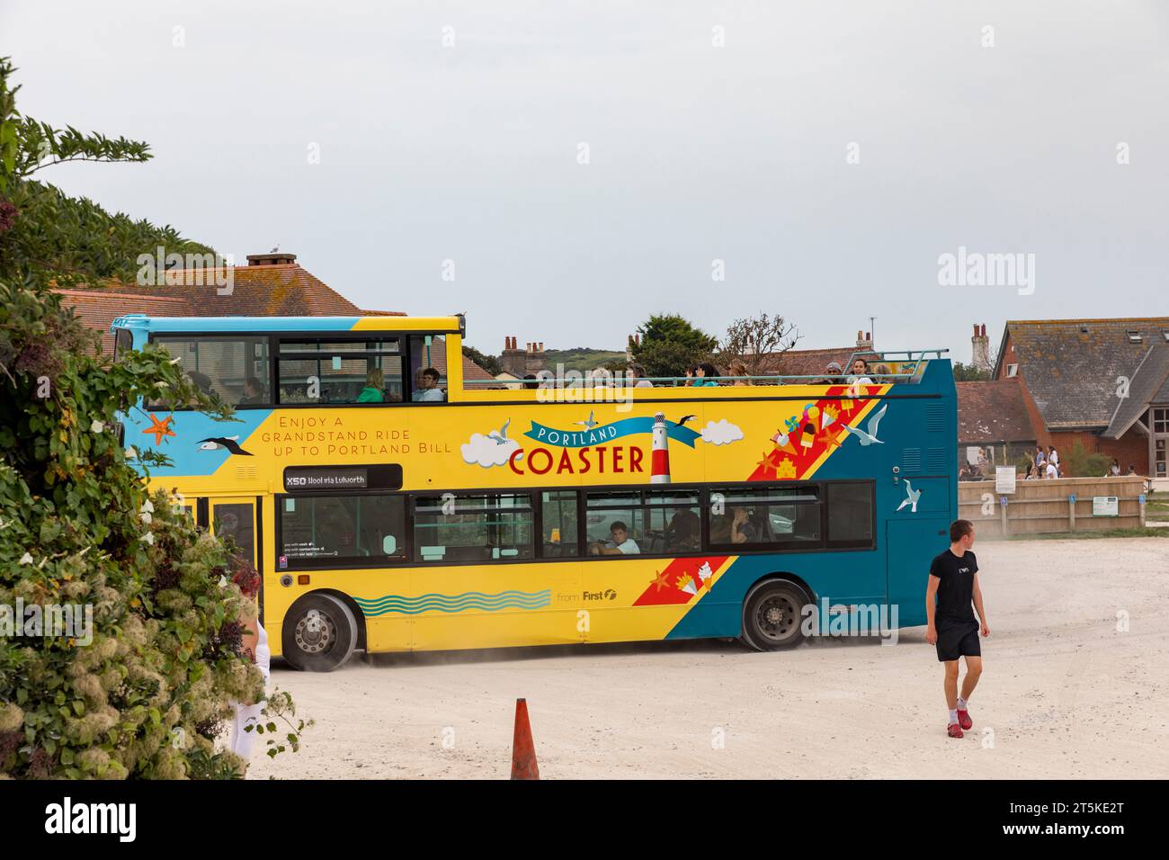 Portland coaster open top tour bus of the Jurassic coast picking up ...