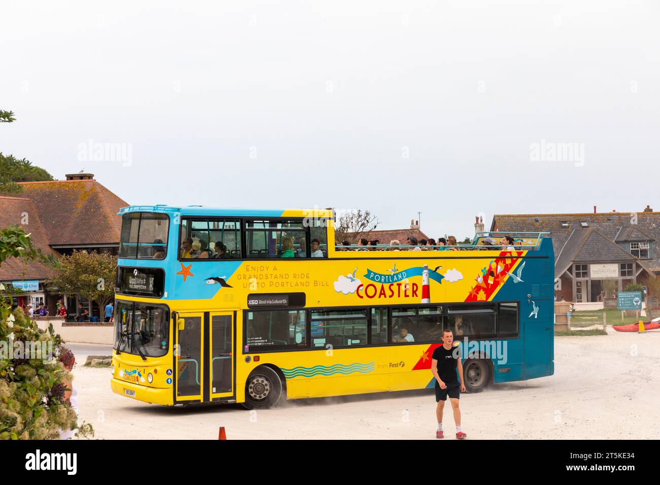 Portland coaster open top tour bus of the Jurassic coast picking up ...