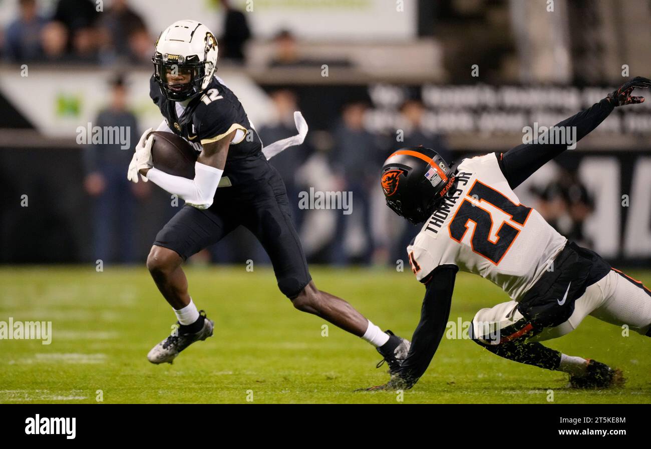 Colorado cornerback Travis Hunter (12) avoids Oregon State defensive ...