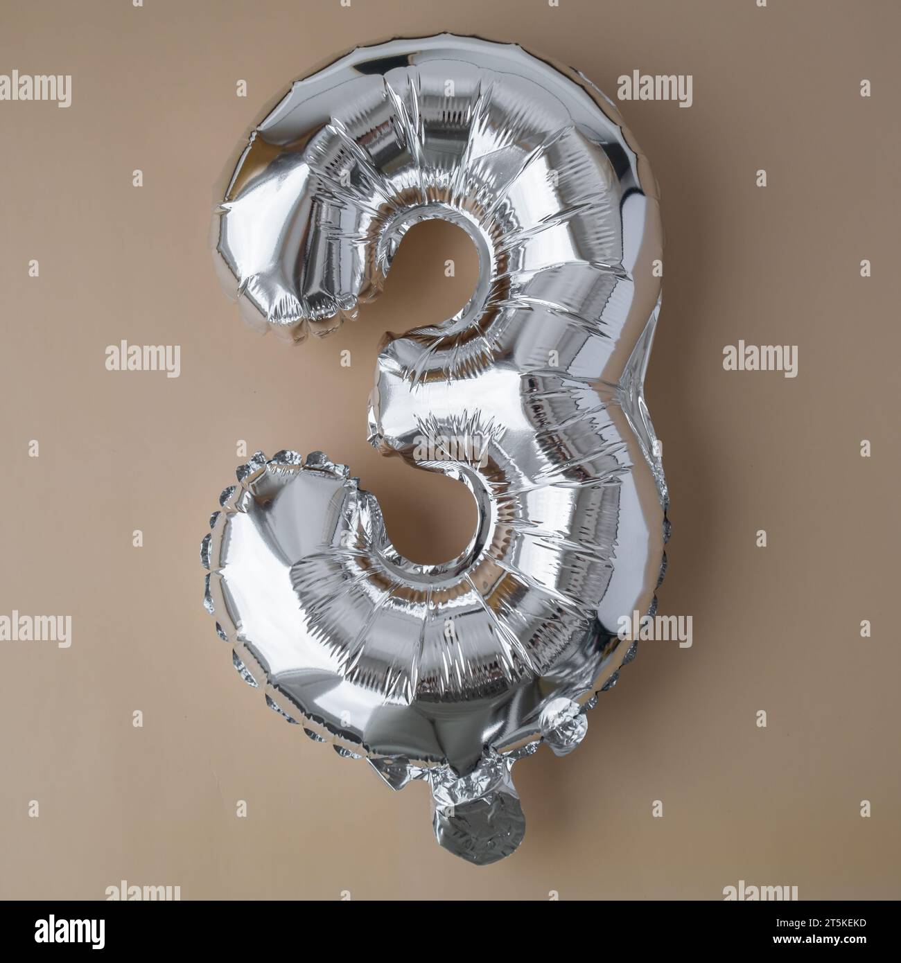 3 three metallic balloon on beige neutral background. Greeting card ...