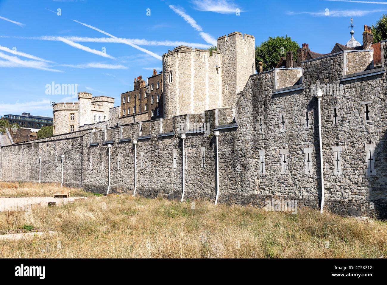 Tower of London in city of London, perimeter stone walls against deep ...