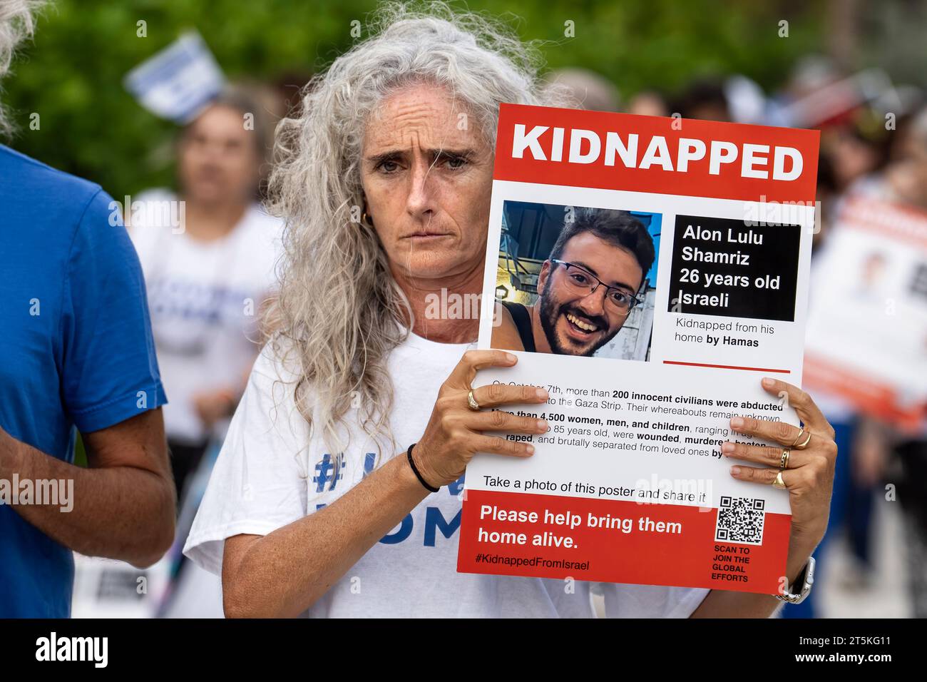 Surfside, Florida, USA. 5th Nov, 2023. A woman holds a poster of Alon ...