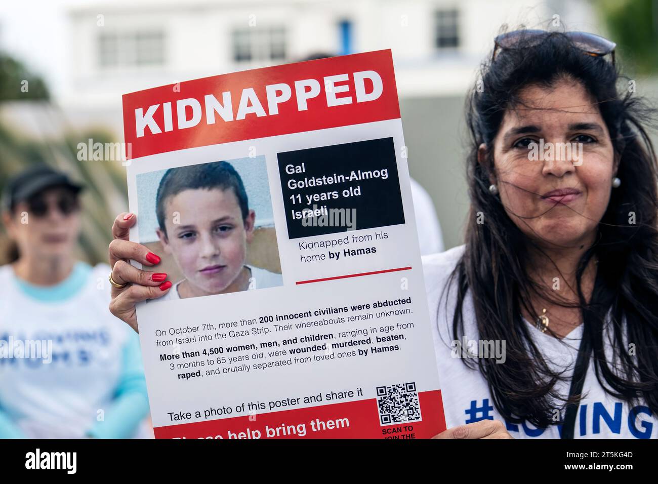 Surfside, Florida, USA. 5th Nov, 2023. A woman holds posters of 11 ...