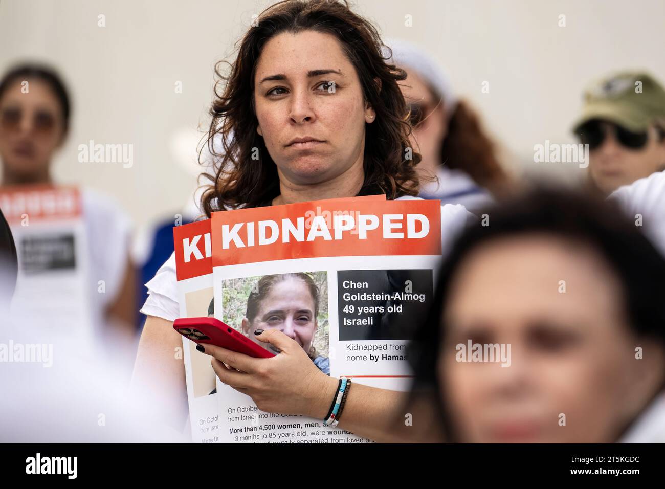 Surfside, Florida, USA. 5th Nov, 2023. A woman holds a poster of Chen ...