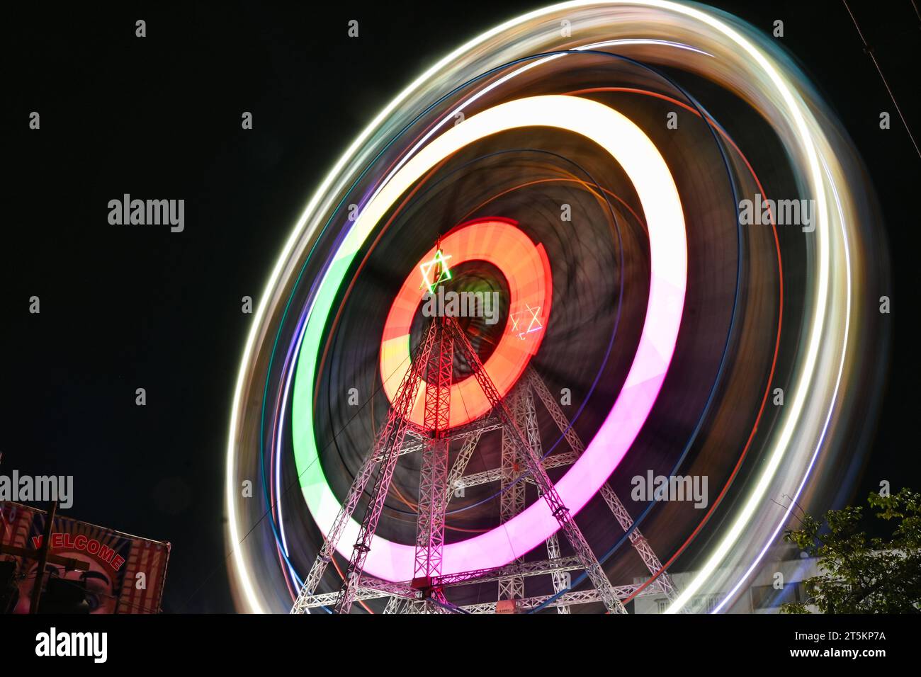 Slow shutterspeed picture of ferris wheel or giant wheel over dark sky ...