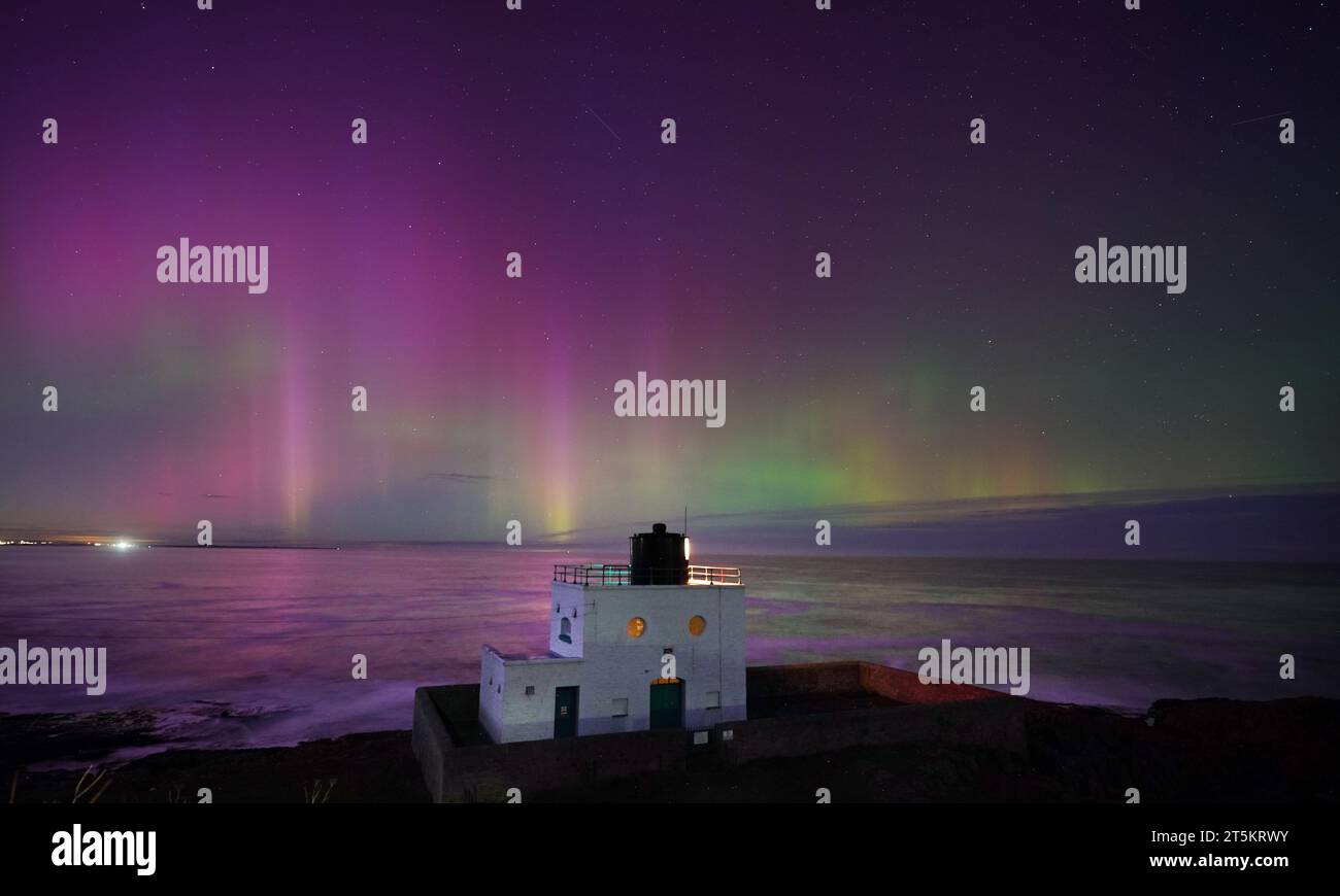 The aurora borealis, also known as the northern lights, appears over ...