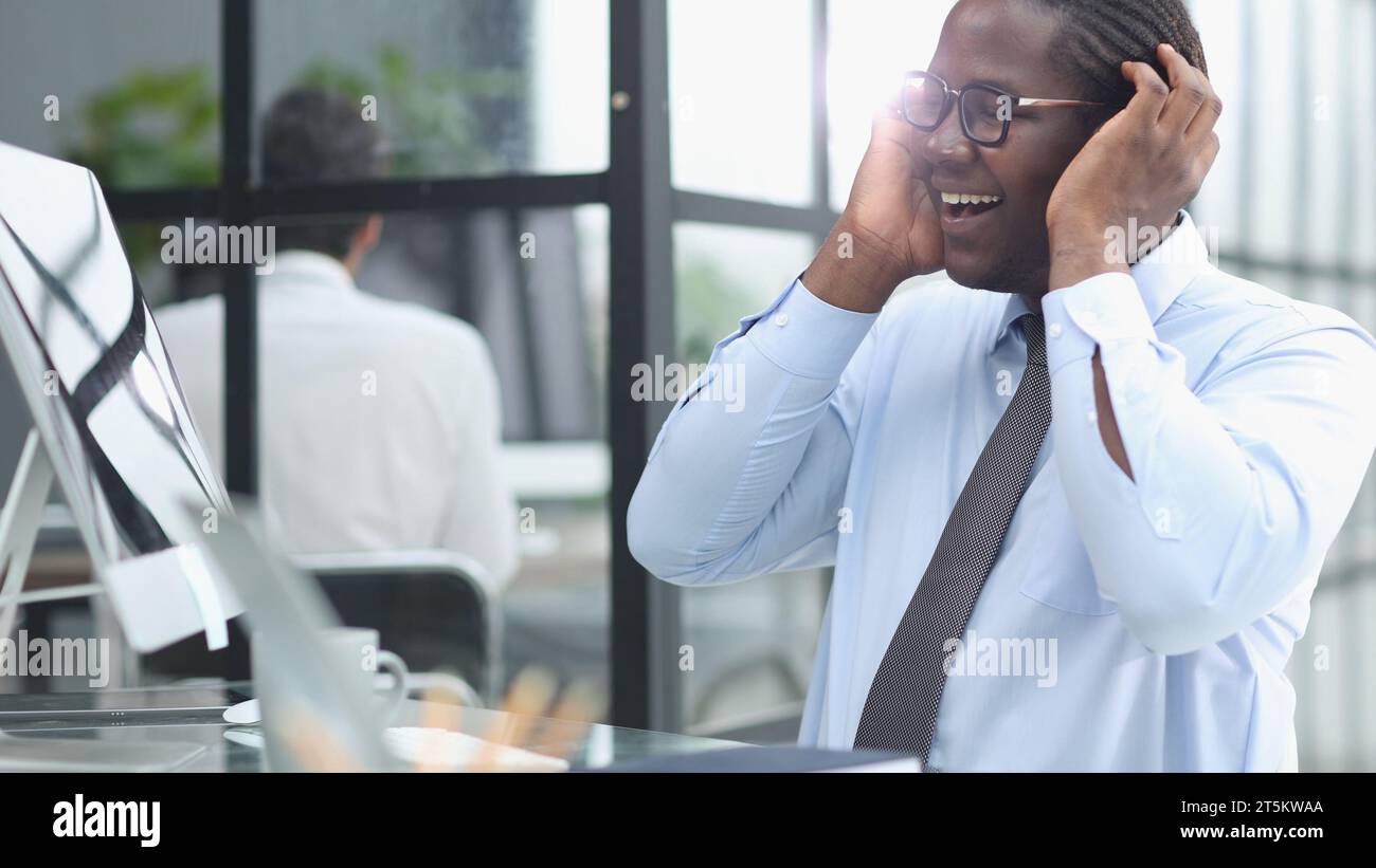 happy man working in the office. raised his hands joyfully Stock Photo ...