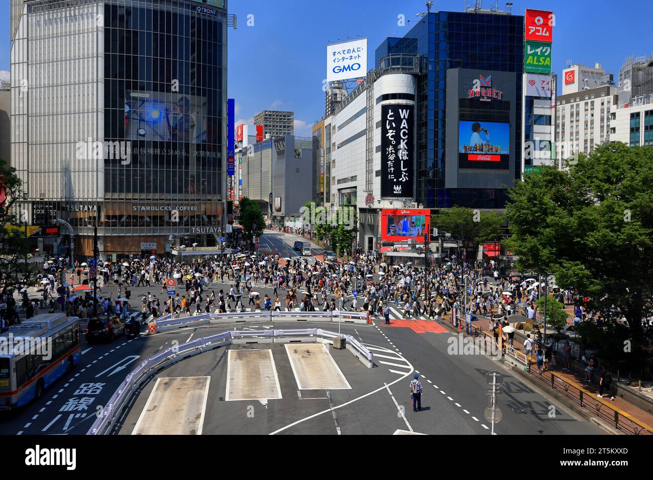 Shibuya Scramble Crossing with many people crossing the junction in ...