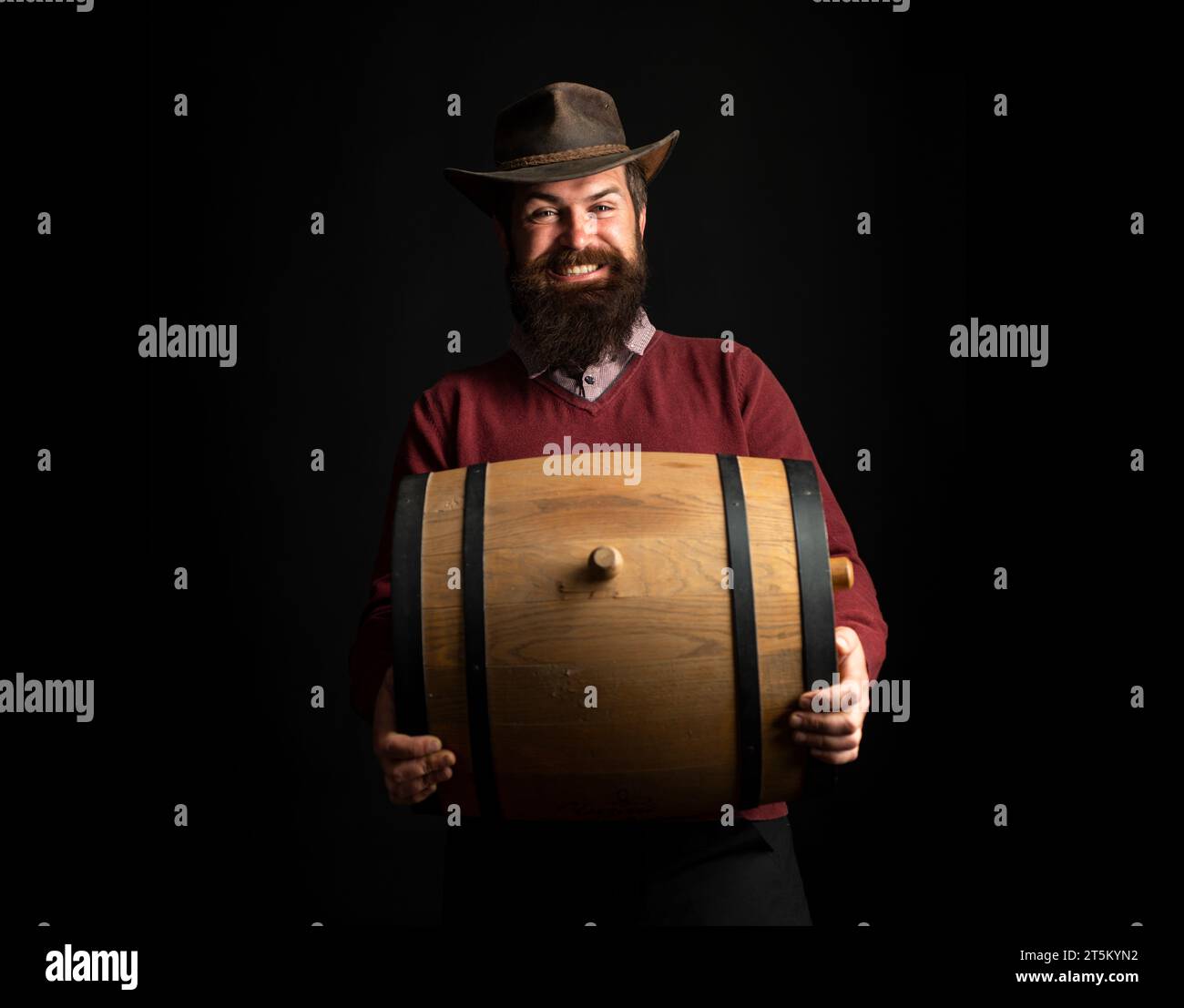 Man hold wooden barrel on black. Oktoberfest. Bearded brewer man ...