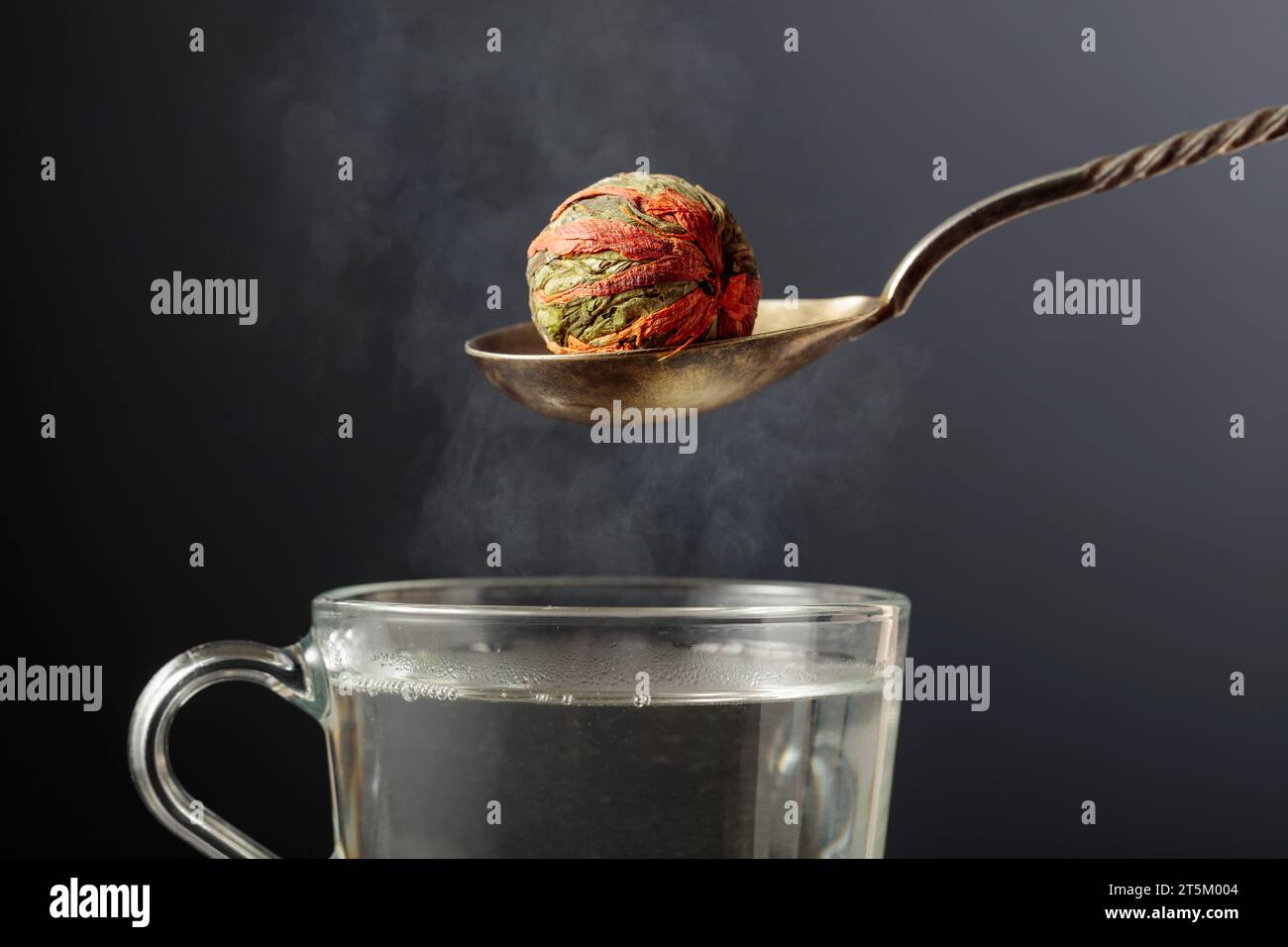 Chinese green tea ball with jasmine and marigold (calendula) flowers ...