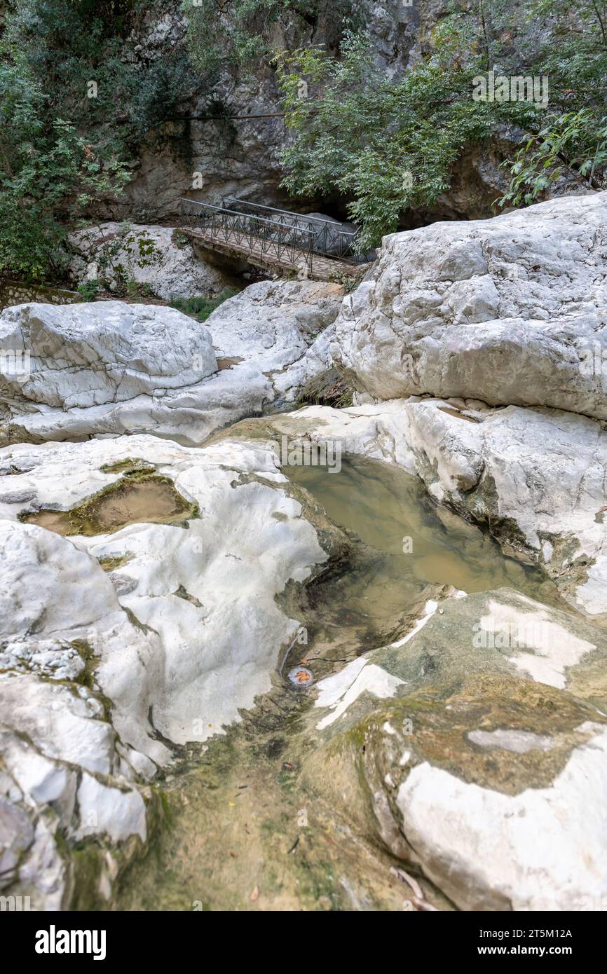A walking trail following the river bed leading to a waterfall. Nydri ...