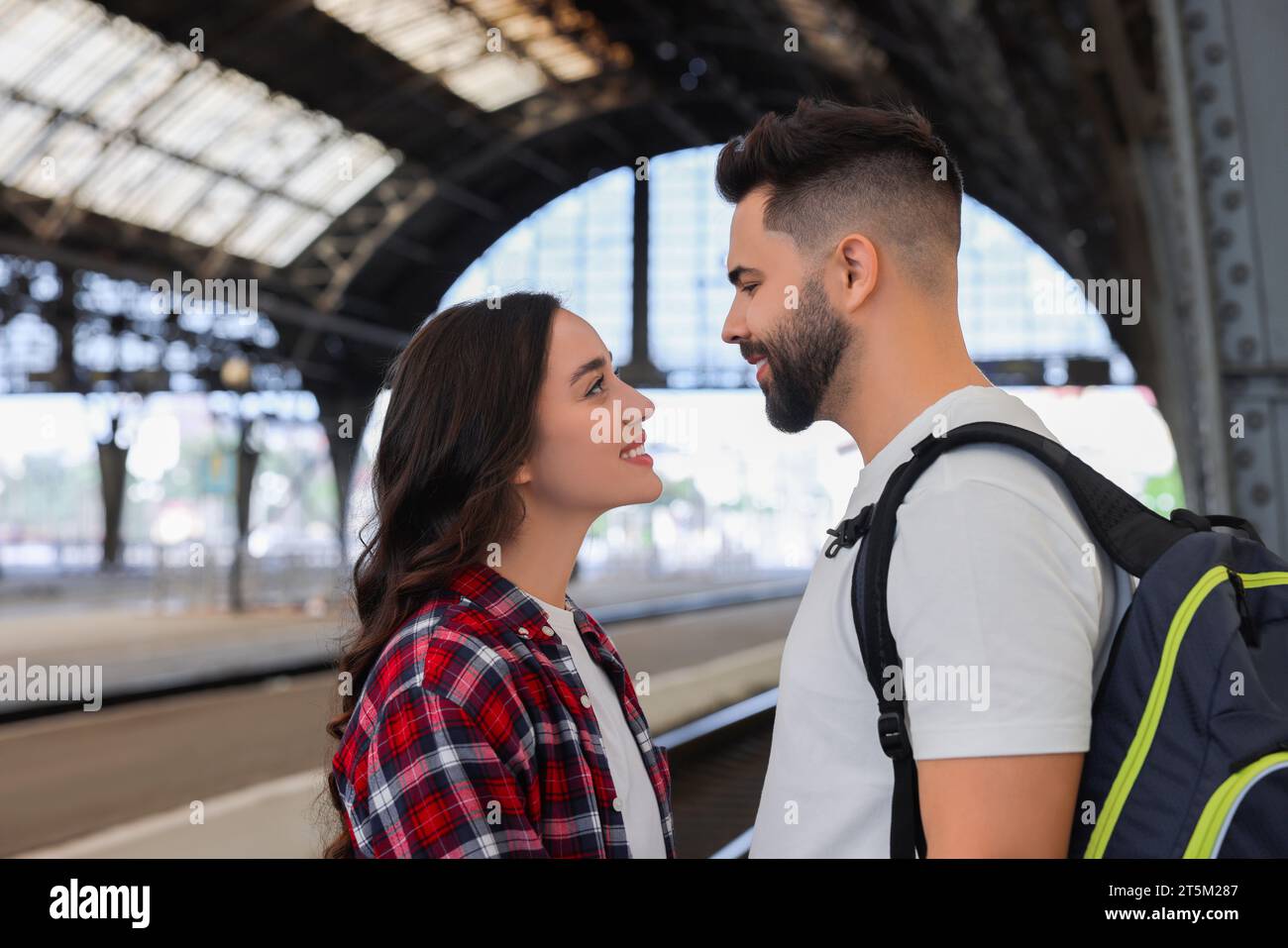 Long-distance relationship. Beautiful couple on platform of railway ...