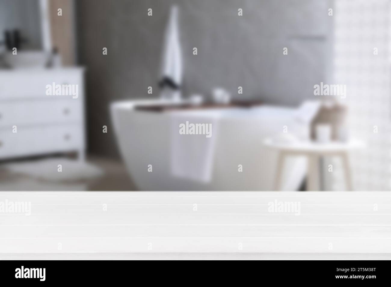 Empty white wooden table in bathroom. Space for design Stock Photo - Alamy
