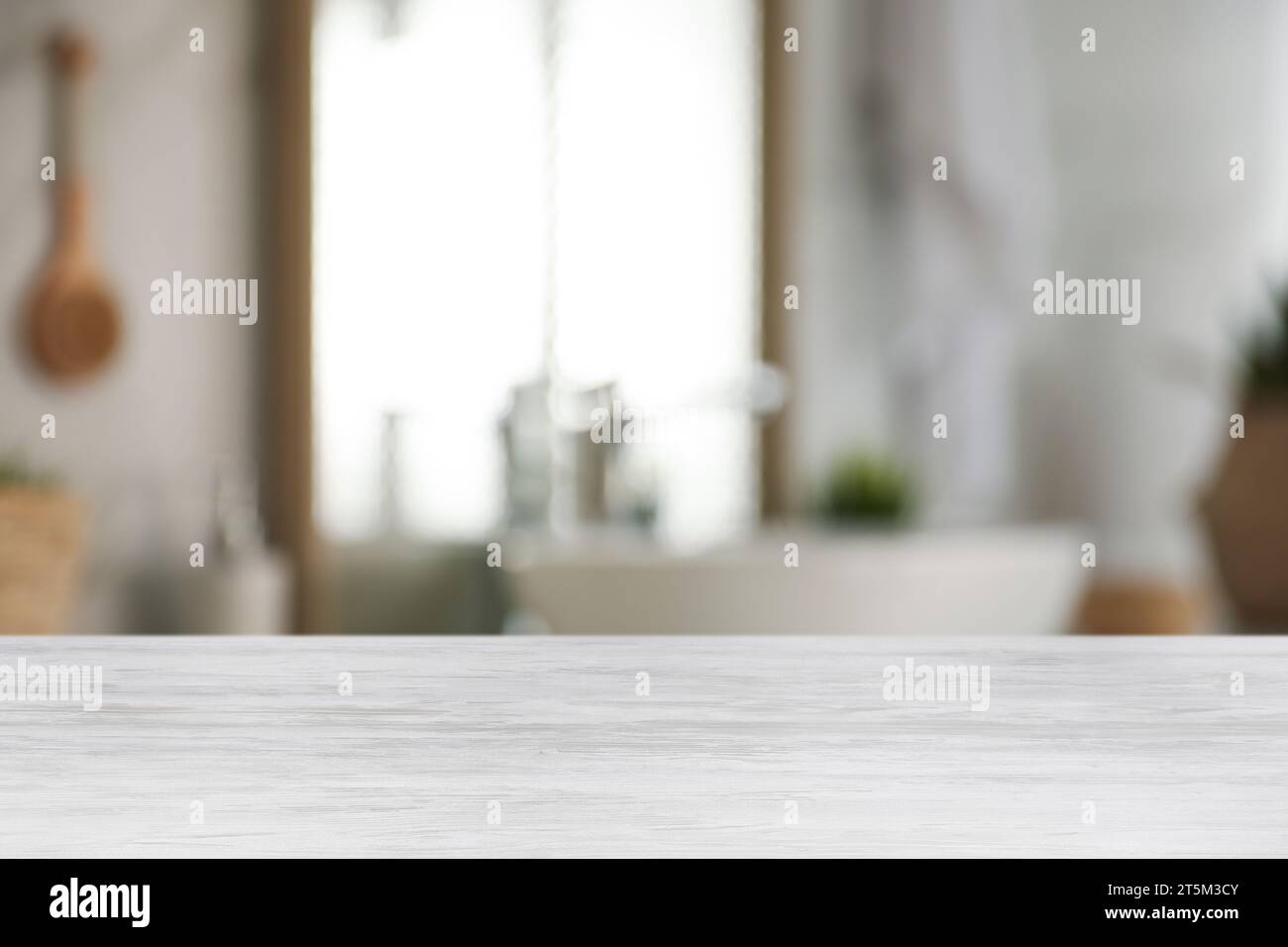Empty white wooden table in bathroom. Space for design Stock Photo - Alamy