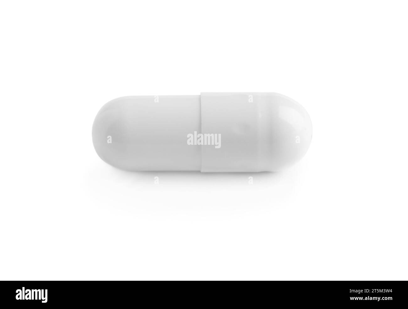 One pill on white background. Medicinal treatment Stock Photo - Alamy