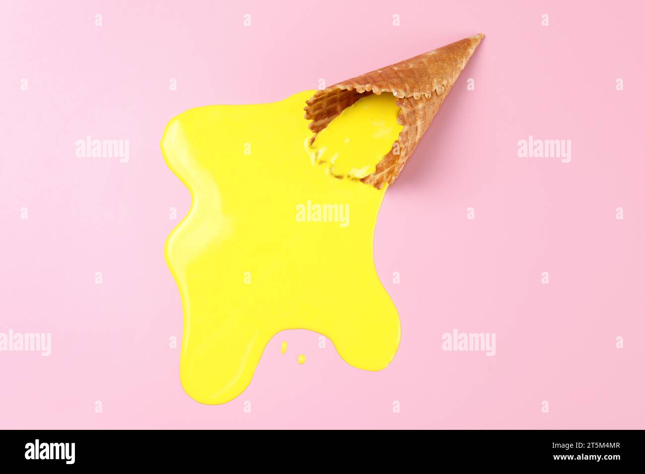 Melted ice cream and wafer cone on pink background, top view Stock ...
