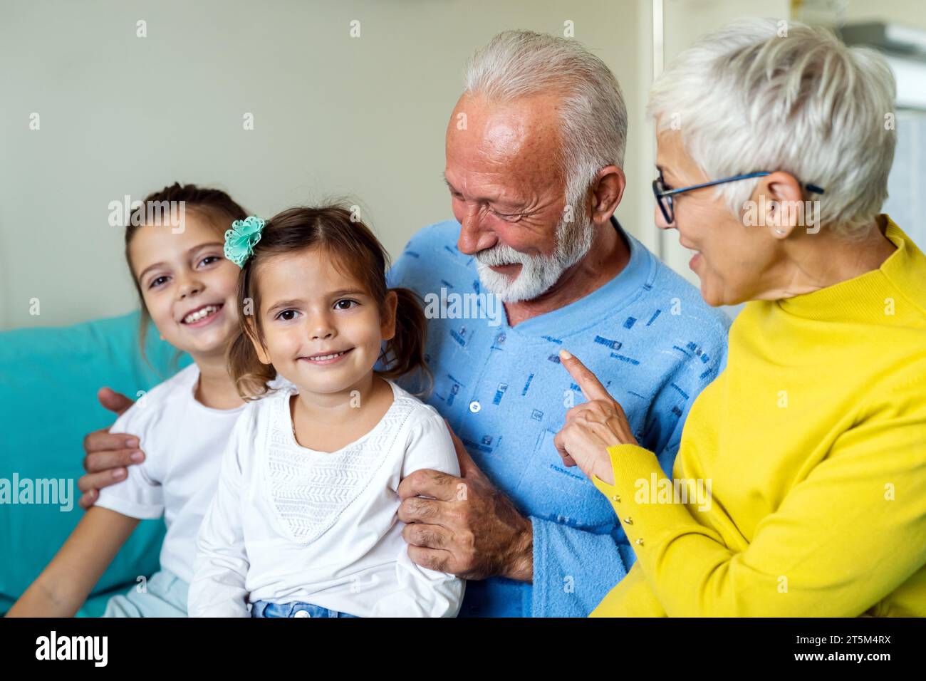 Happy children having fun and love with their grandparents together ...