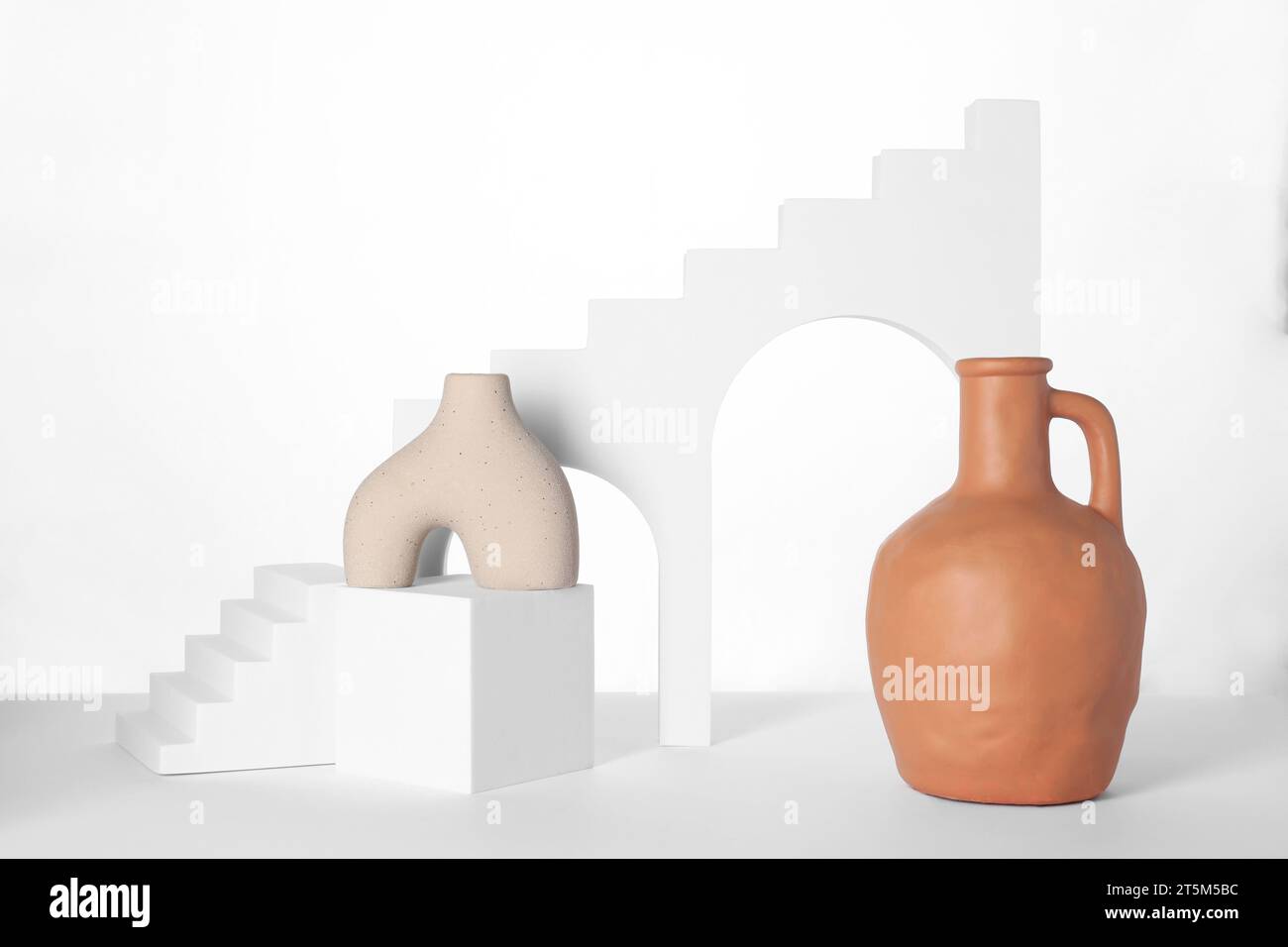 Clay flagon and decorative elements on white background Stock Photo - Alamy