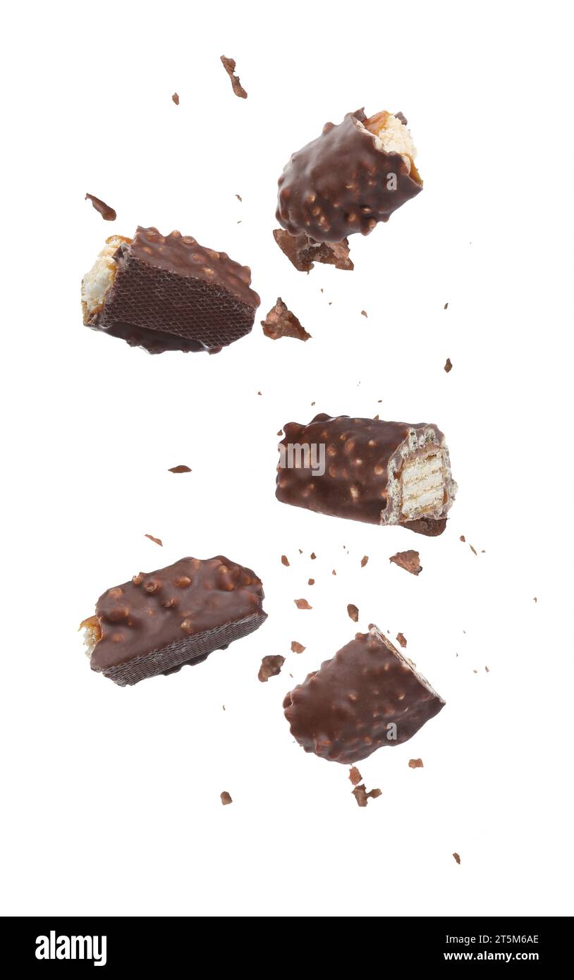 Pieces of chocolate bars falling on white background Stock Photo - Alamy