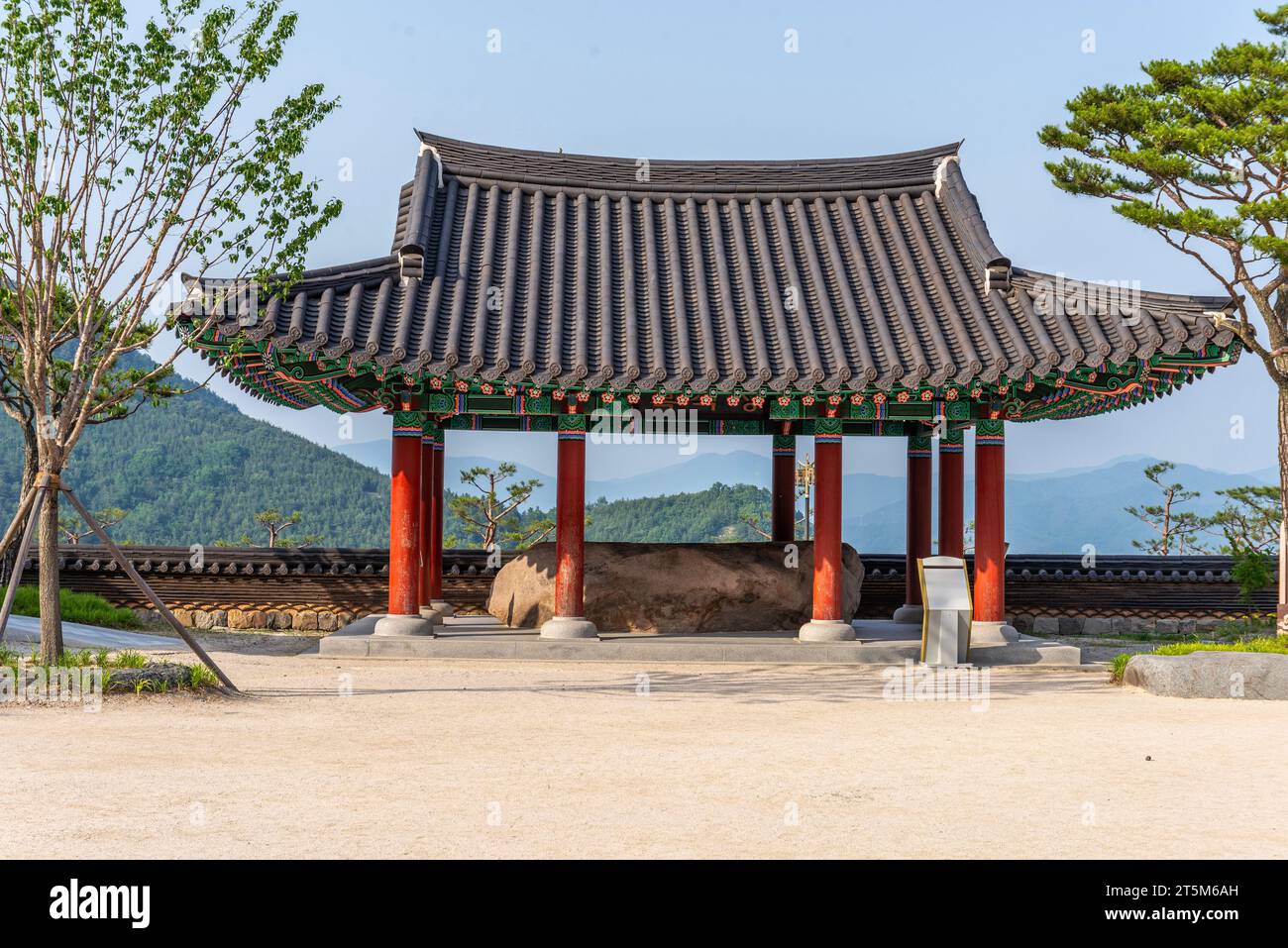Korean traditional pavilion with large rock in it Stock Photo - Alamy