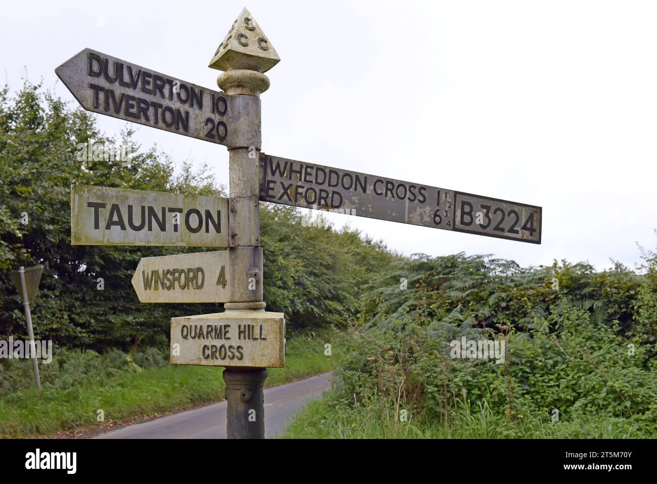 Historic road sign fingerpost at Quarme Hill Cross in Exmoor, North ...