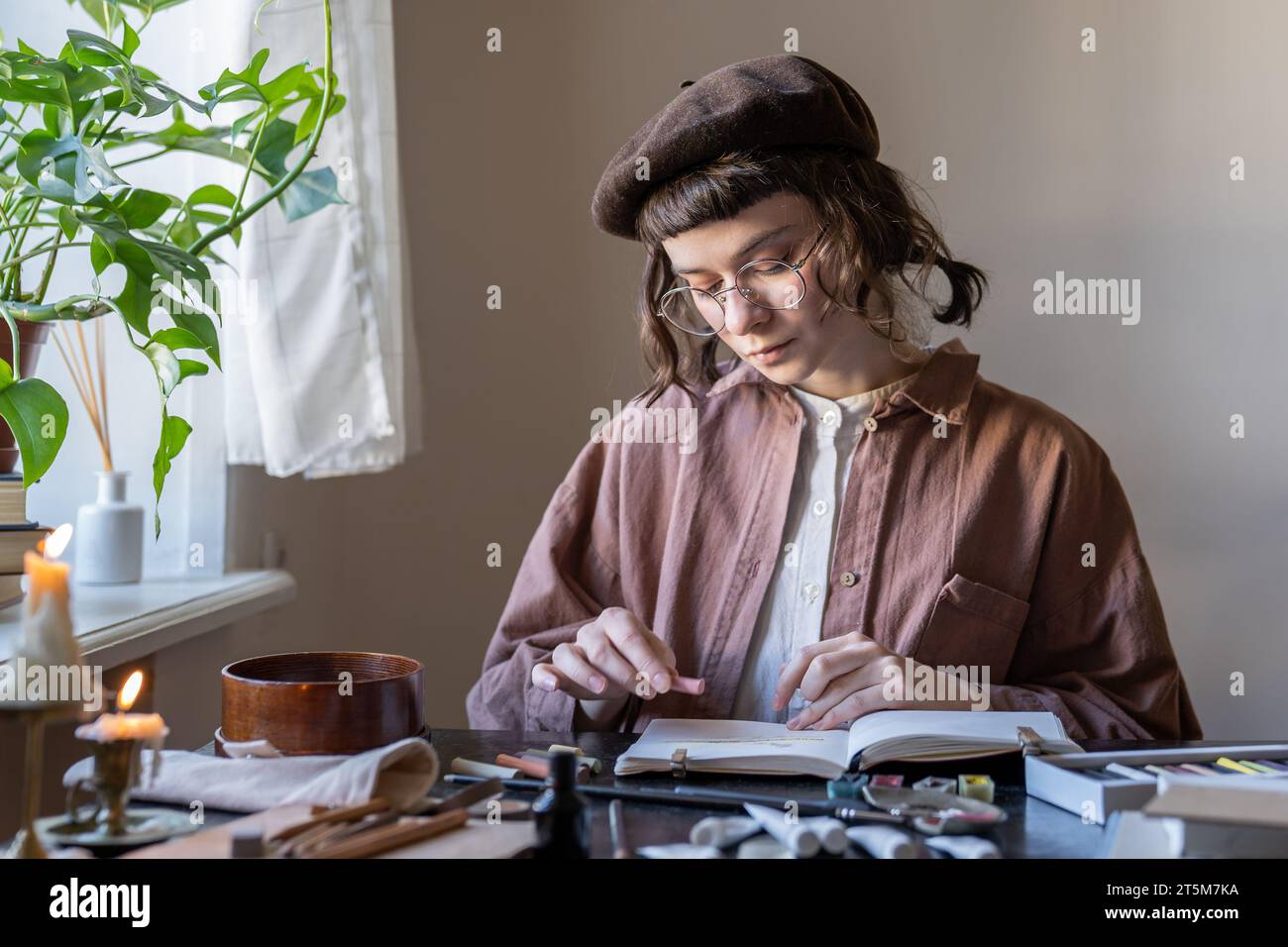 Professional teenage cartoon artist-illustrator creating animation in ...